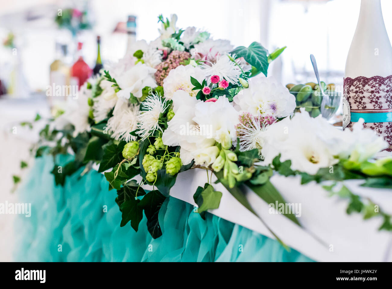 Food table decorated with flowers Stock Photo - Alamy