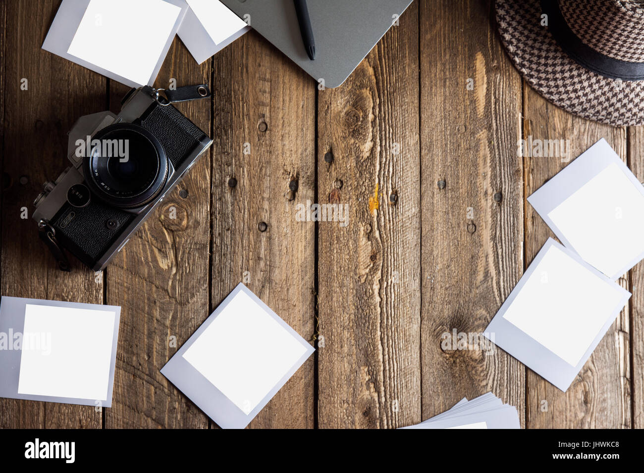 Vintage photo camera. Blank photo frames. Old photographs of paper, on ...