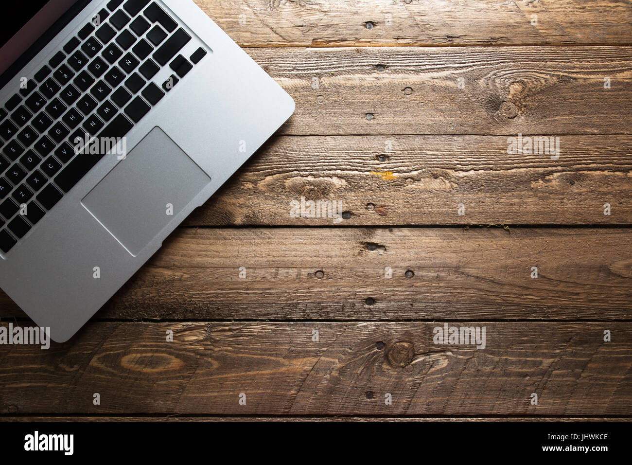 Top view of open laptop ready to work standing on the wooden table ...
