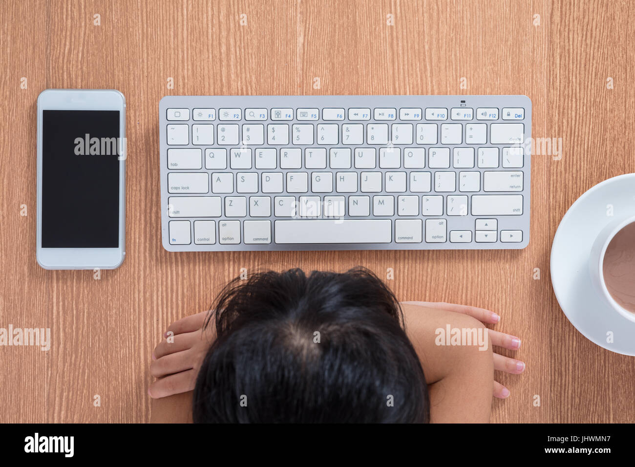 A child resting on desk in the office Stock Photo - Alamy