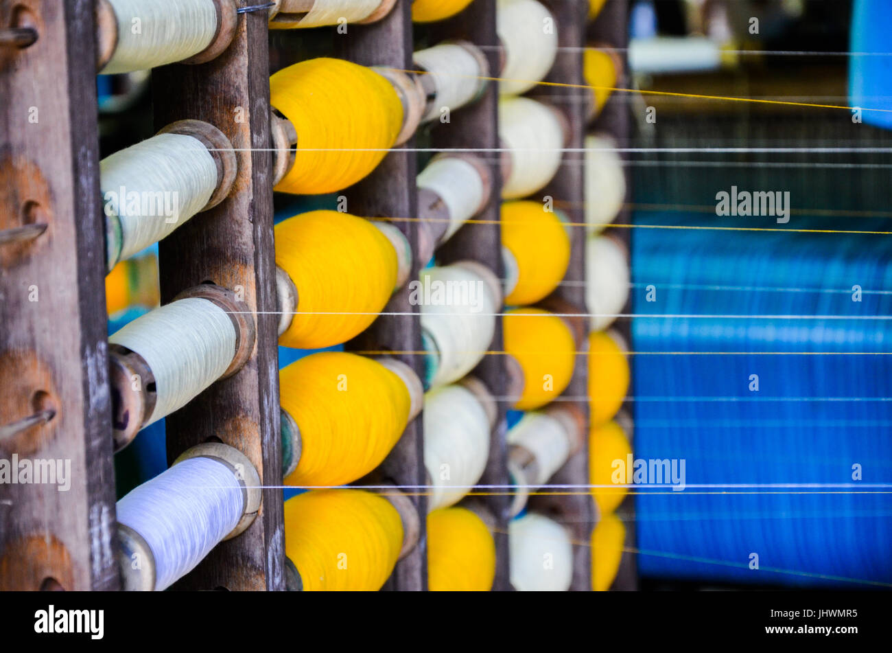 Industrial cotton reels for weaving Stock Photo - Alamy
