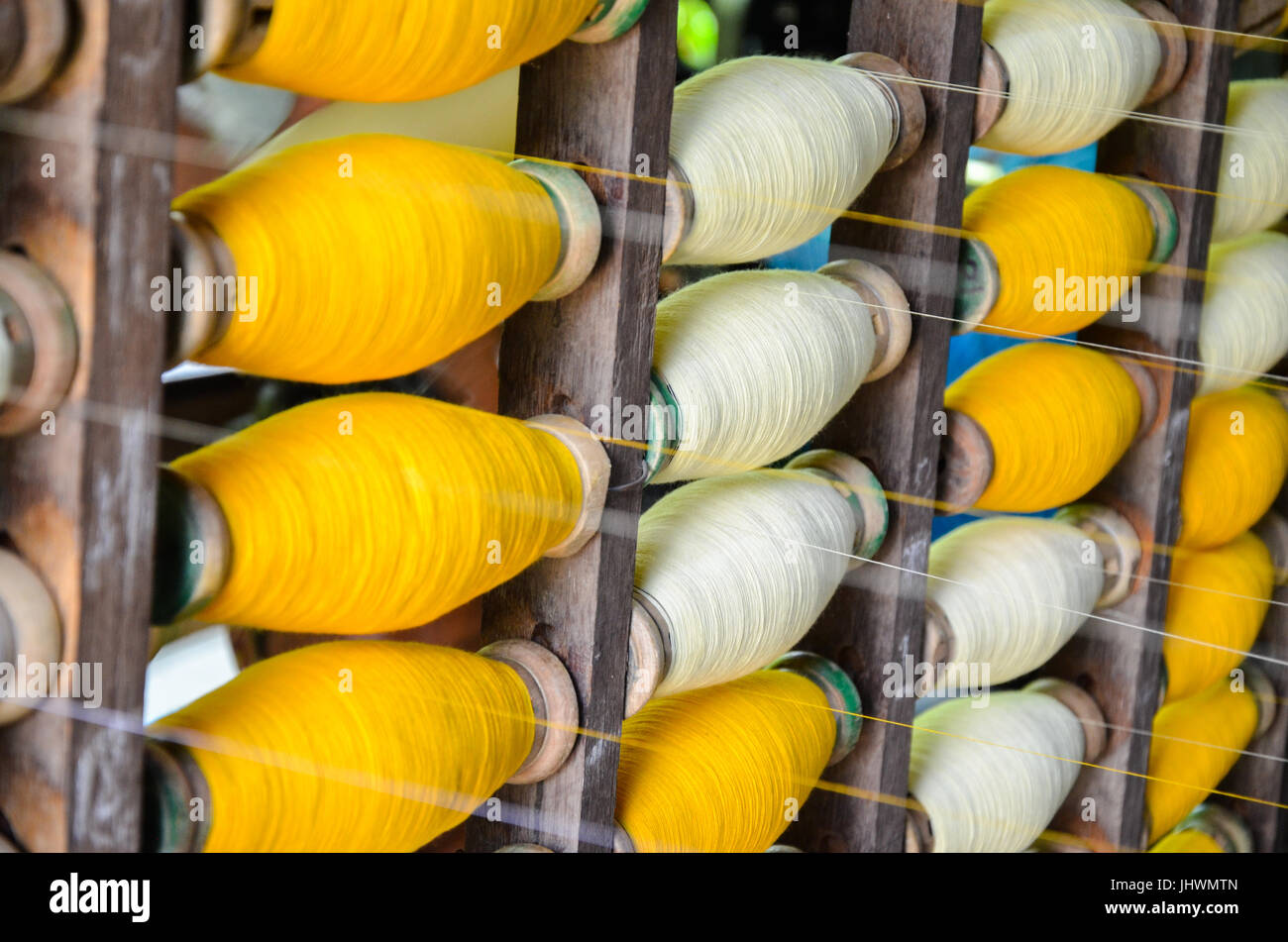 Industrial cotton reels for weaving Stock Photo - Alamy