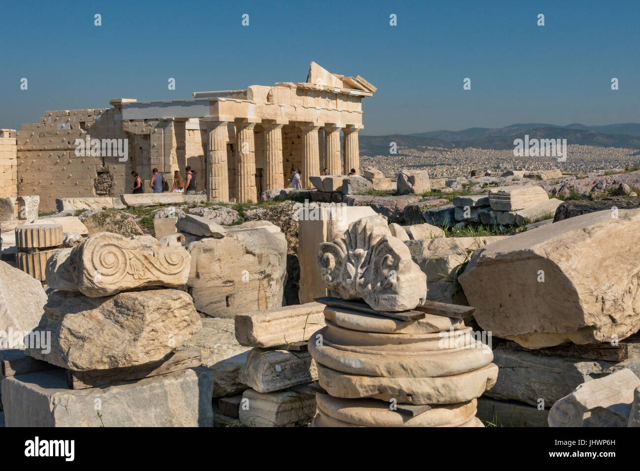 Entrance of the Acropole, seen behind marble parts on the ground ...