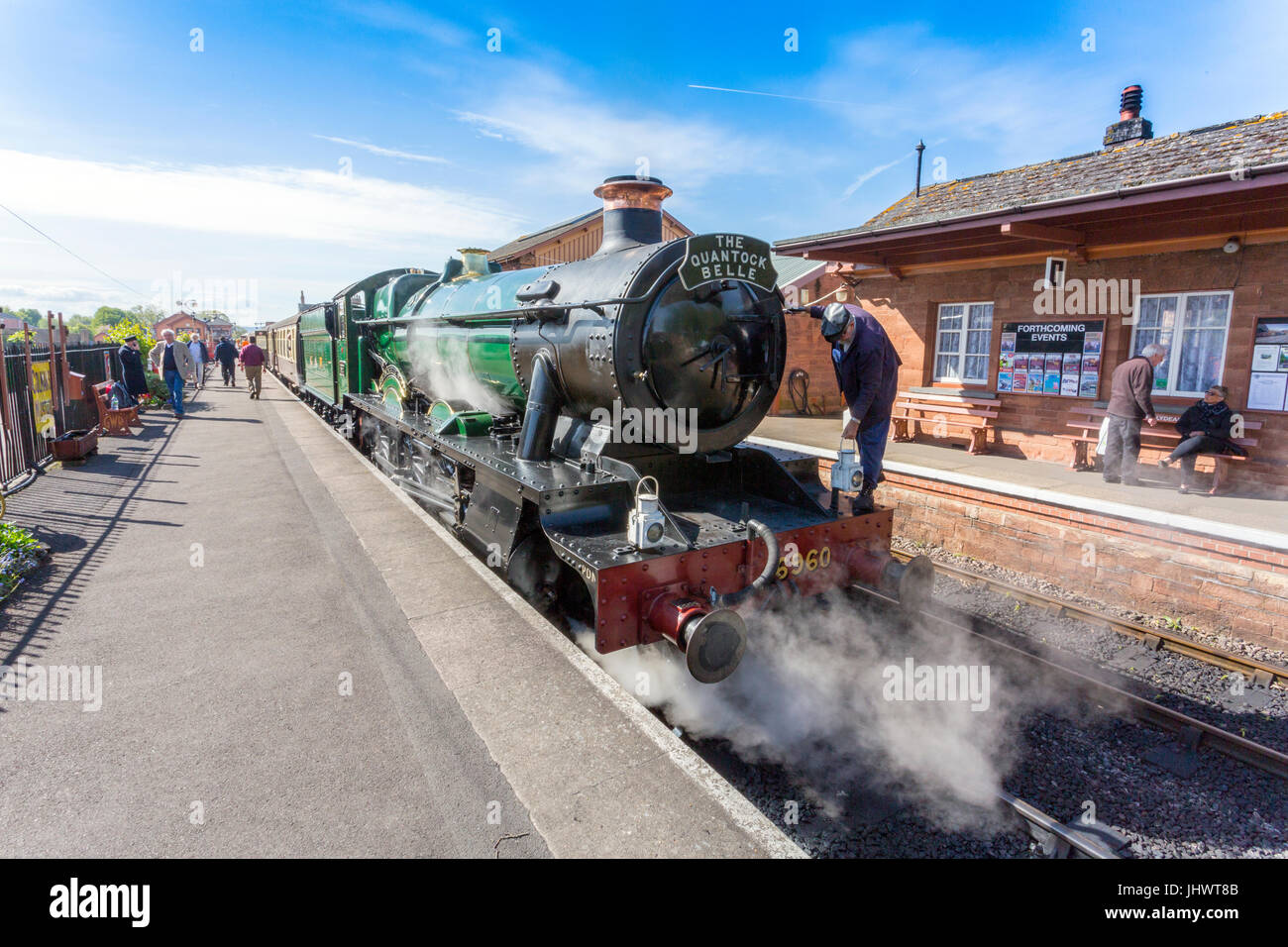 The driver of ex-GWR loco 6960 'Raveningham Hall' puts a headlamp on ...