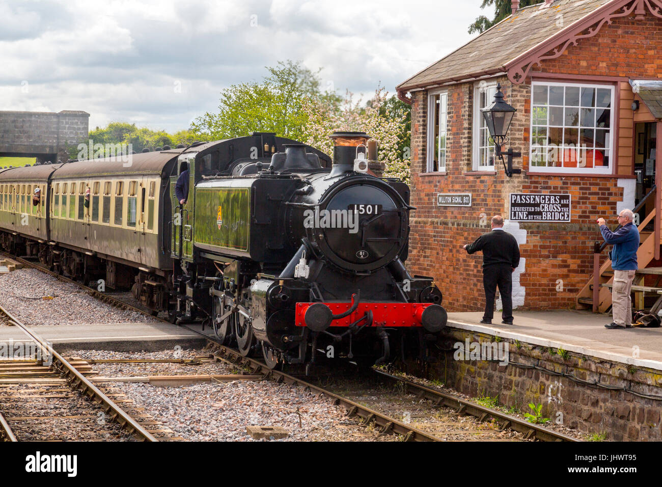 Ex-BR tank engine 1501 arrives at Williton station with a train to ...