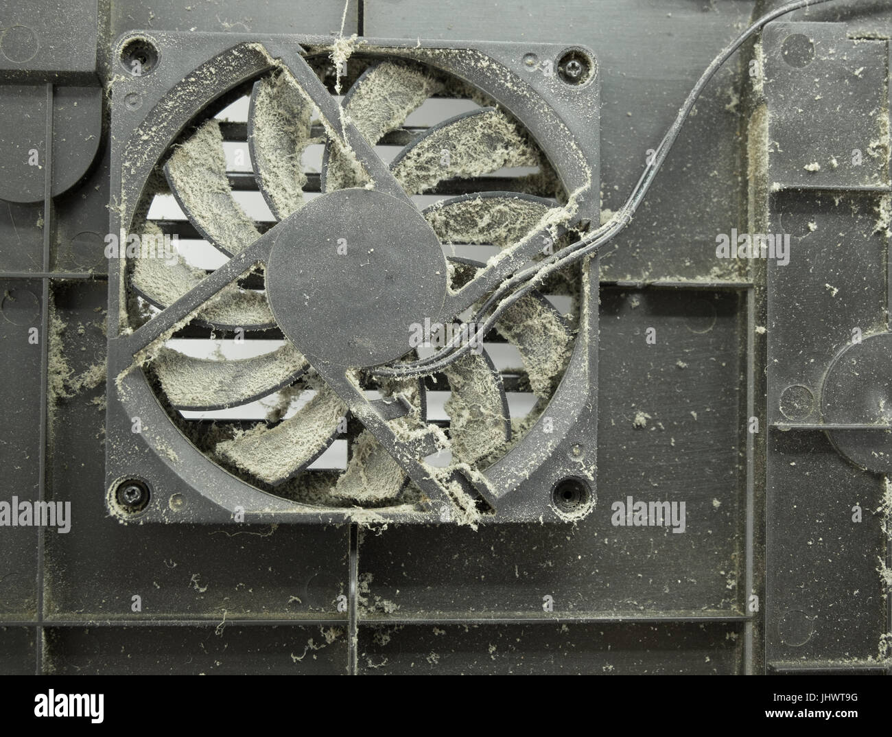 Dusty fan blades of computer processor cooler. Close-up Stock Photo - Alamy
