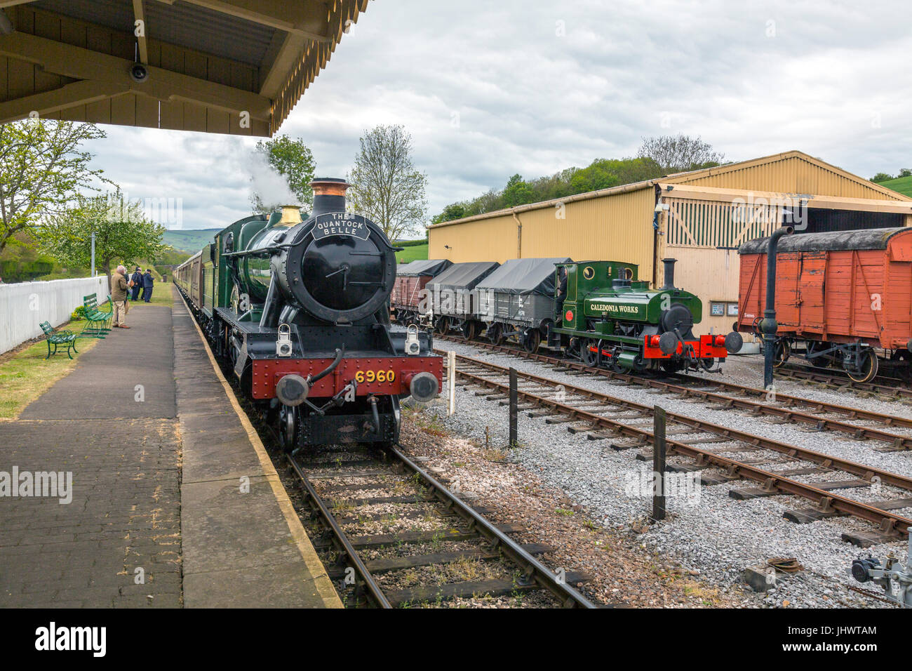 Ex-GWR loco 6960 'Raveningham Hall' arrives in Washford station with a ...
