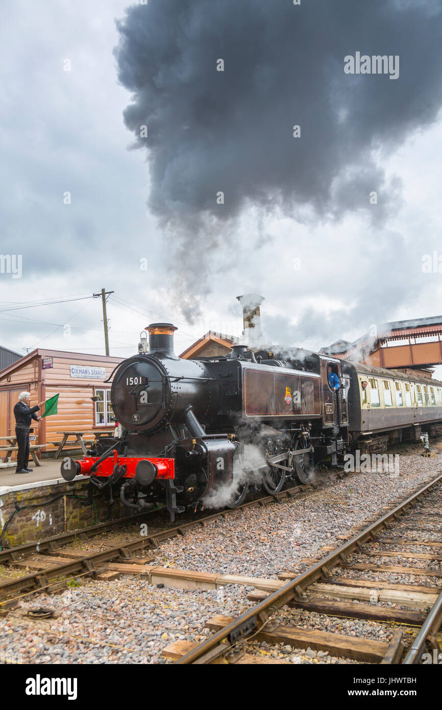 Ex-BR loco 1501 makes a dramatic departure from Williton station with a ...