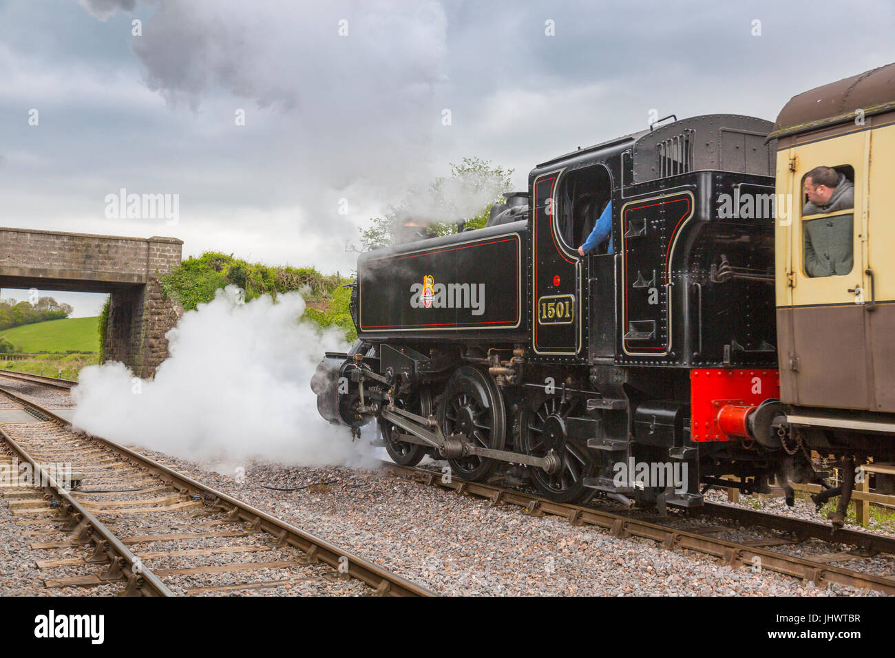 Ex-BR loco 1501 makes a dramatic departure from Williton station with a ...