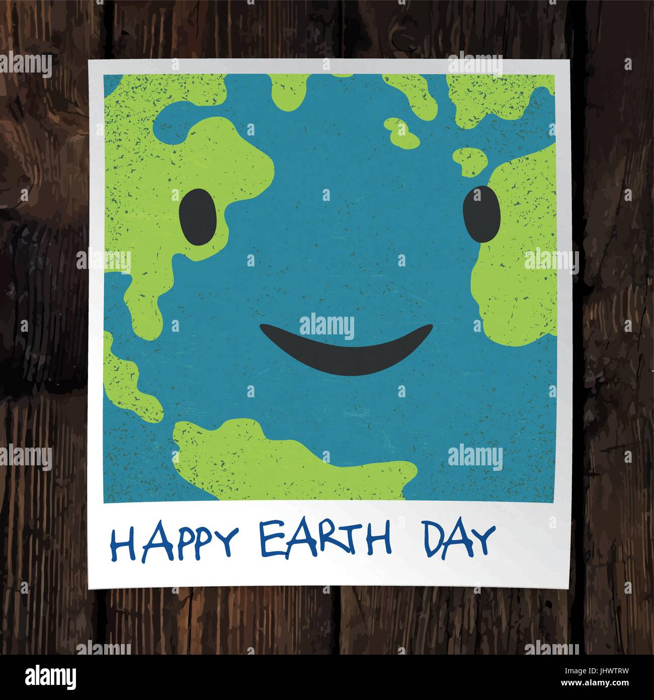 Photo frame with Earth snapshot closeup. Earth day concept. On wooden ...