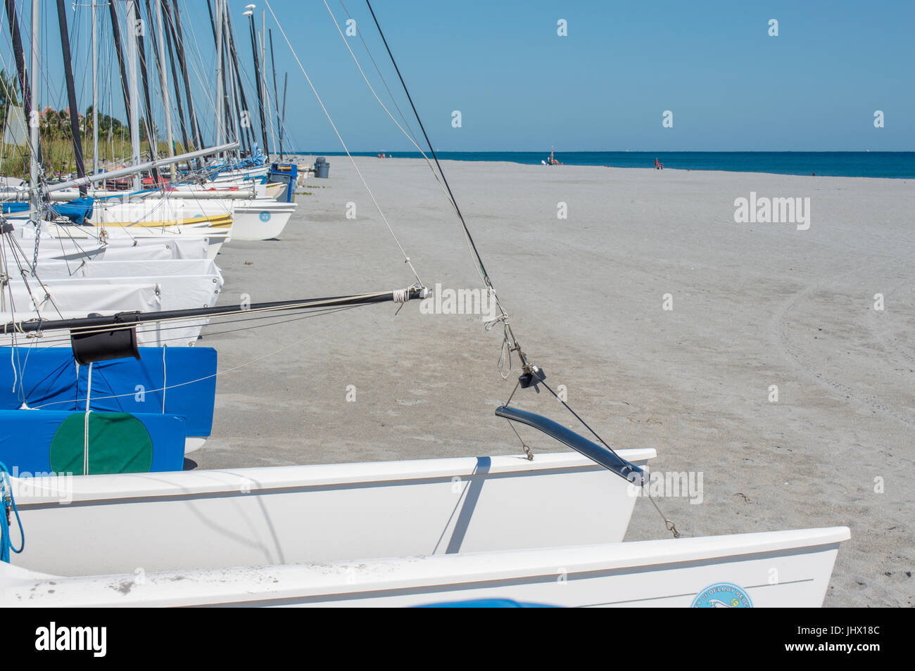 row of empty sailboats for rent on a Florida beach Stock Photo - Alamy