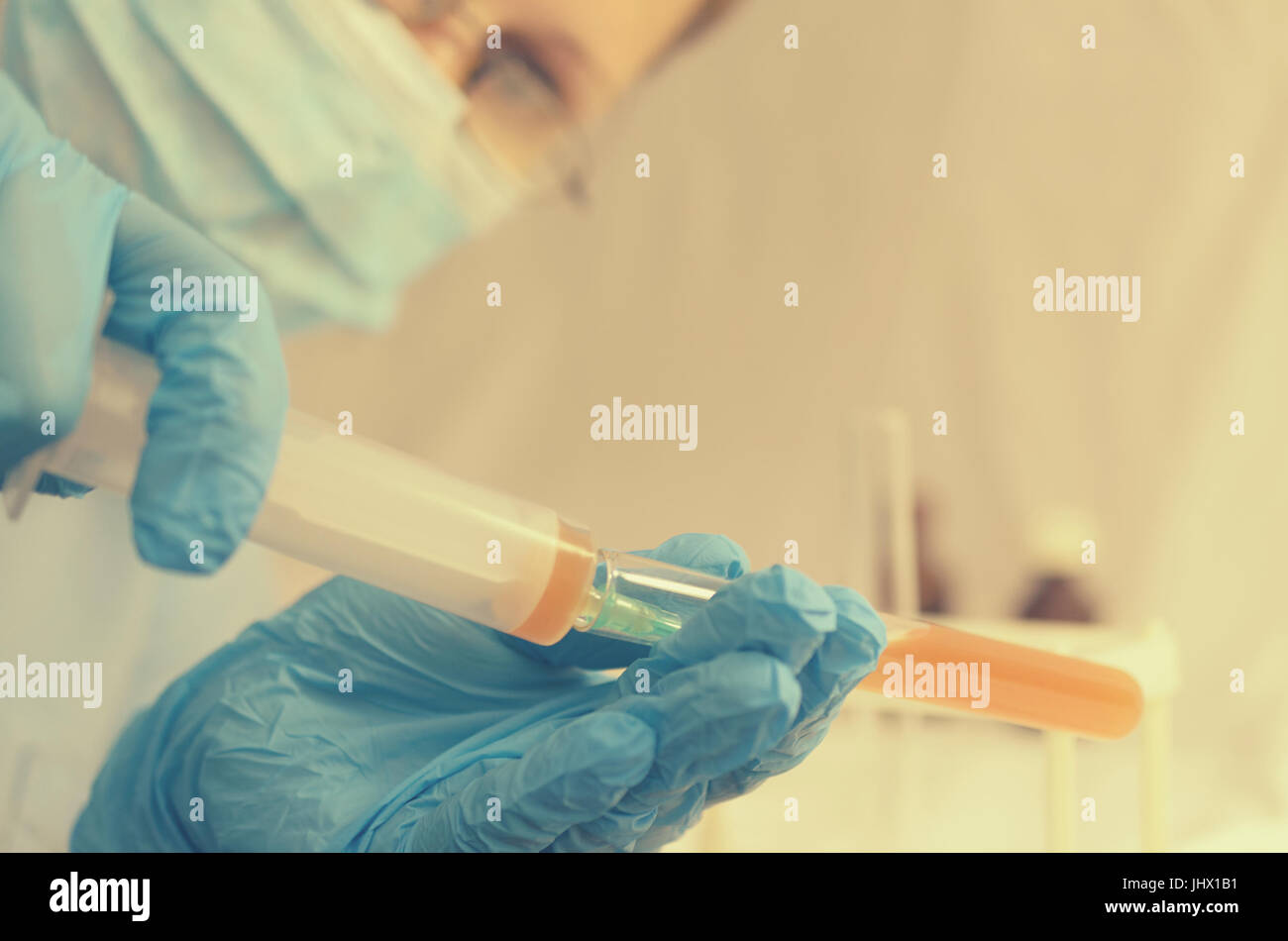 The doctor makes tests with a biological fluid Stock Photo - Alamy