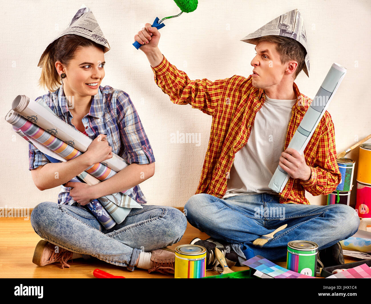 Repair family by happy couple building home . Quarrel family Stock ...
