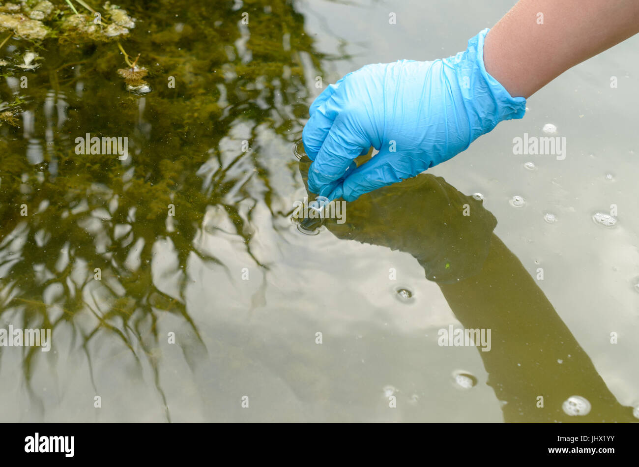 Taking a water test for analysis from a reservoir Stock Photo - Alamy