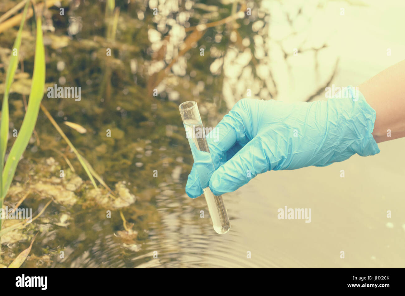Taking a water test for analysis from a reservoir Stock Photo - Alamy