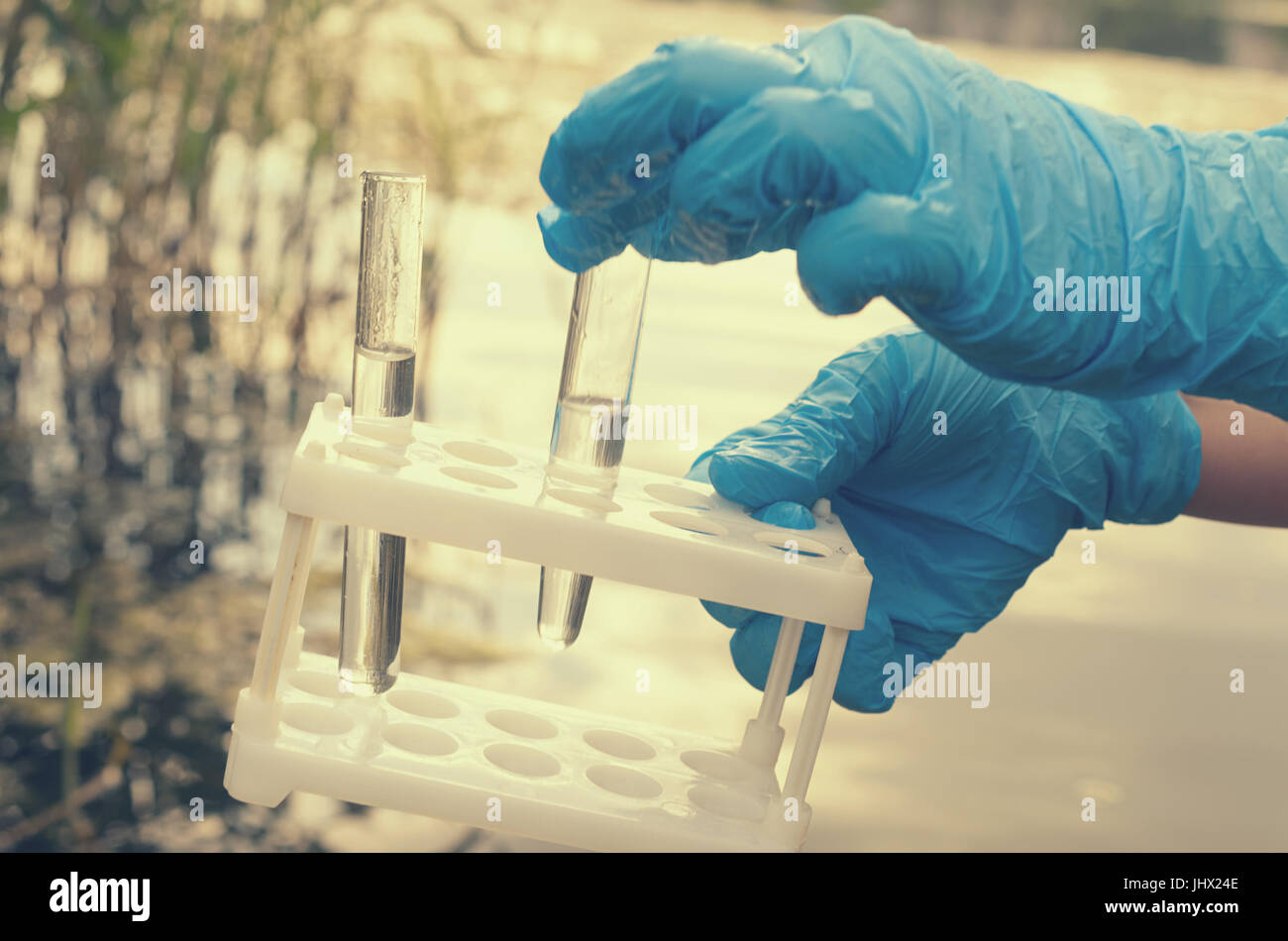 Taking a water test for analysis from a reservoir Stock Photo - Alamy