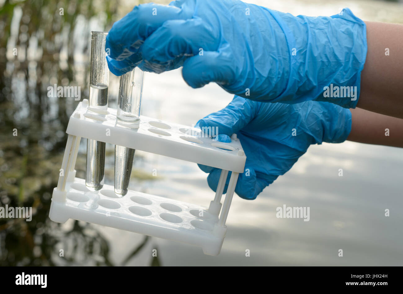 Taking a water test for analysis from a reservoir Stock Photo - Alamy