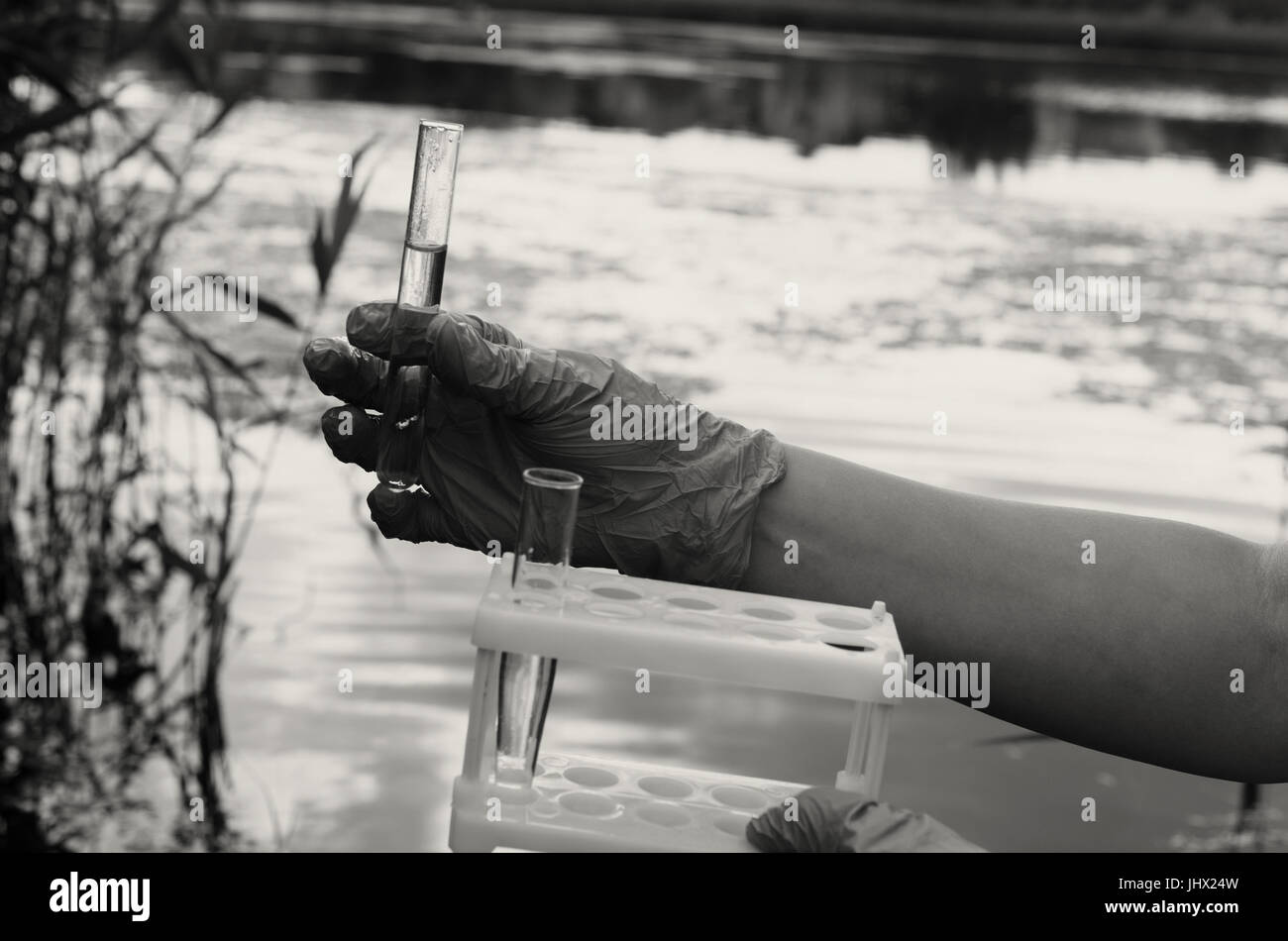 Taking a water test for analysis from a reservoir Stock Photo - Alamy