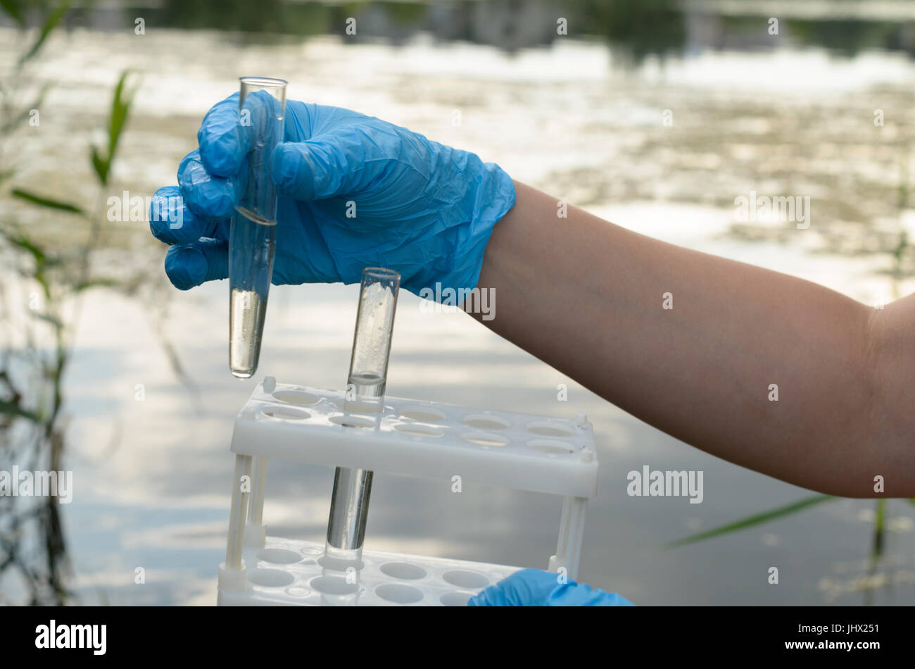 Taking a water test for analysis from a reservoir Stock Photo - Alamy