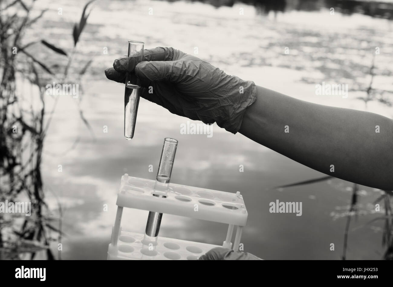 Taking a water test for analysis from a reservoir Stock Photo - Alamy
