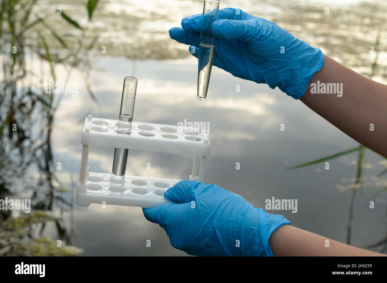 Taking a water test for analysis from a reservoir Stock Photo - Alamy