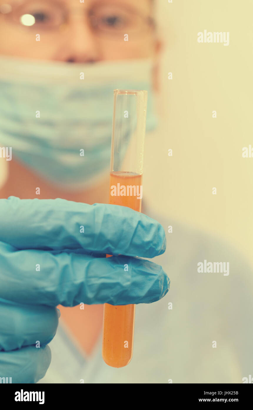 The doctor makes tests with a biological fluid Stock Photo - Alamy