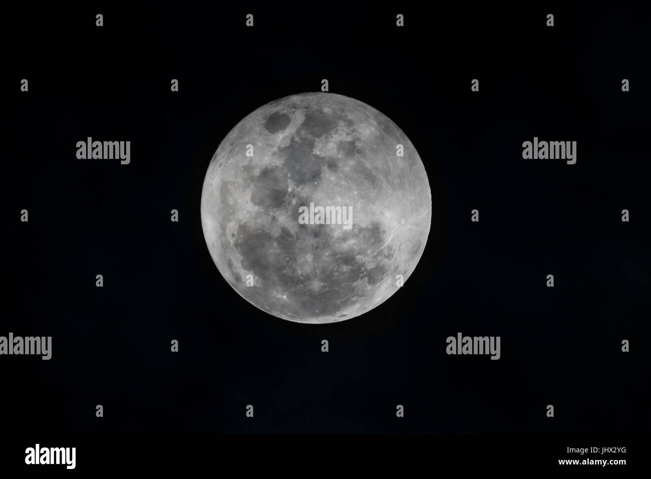 Full moon grey on black background Stock Photo - Alamy