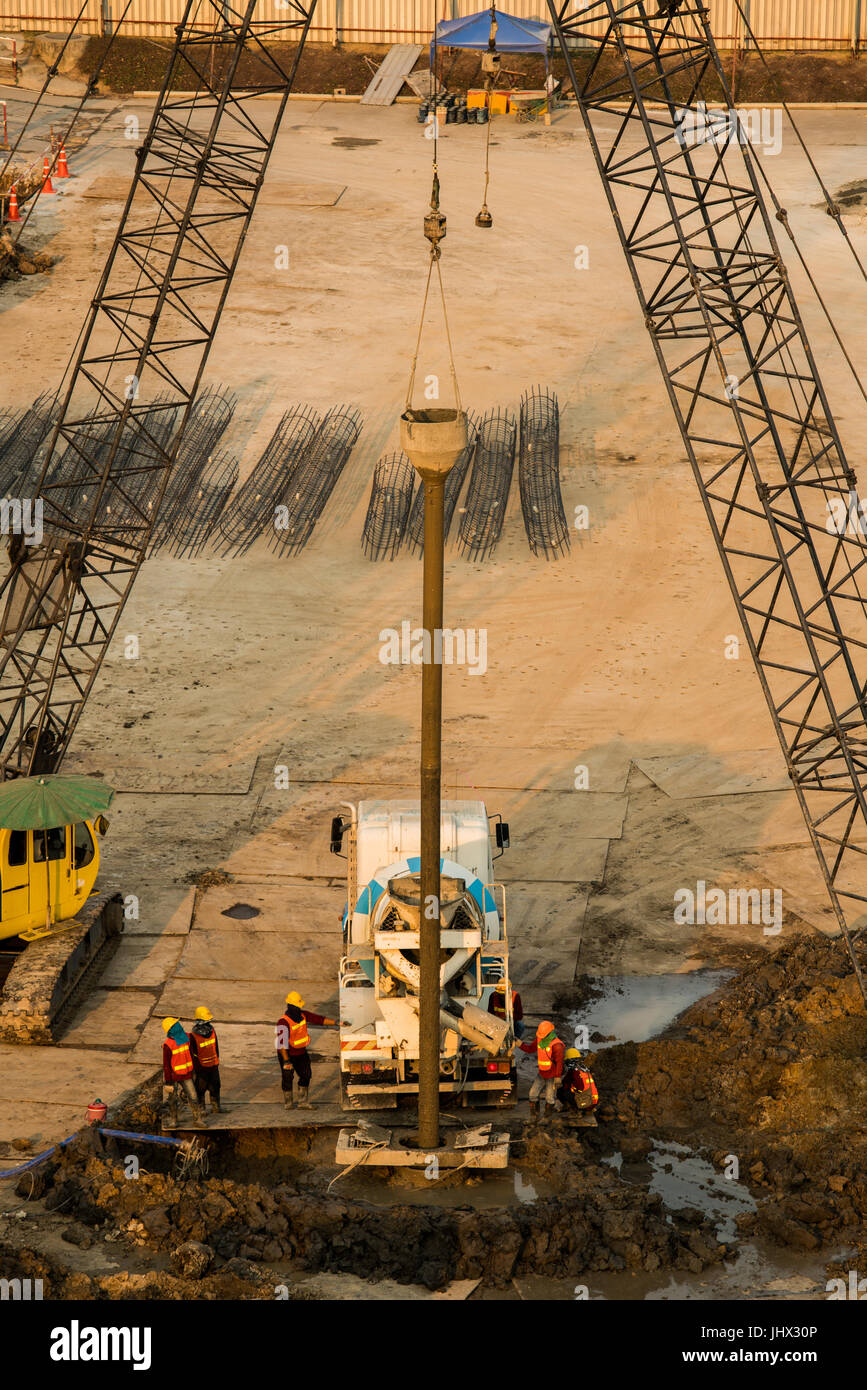 Worker oversee Drilling rigs on ground in construction site Stock Photo ...