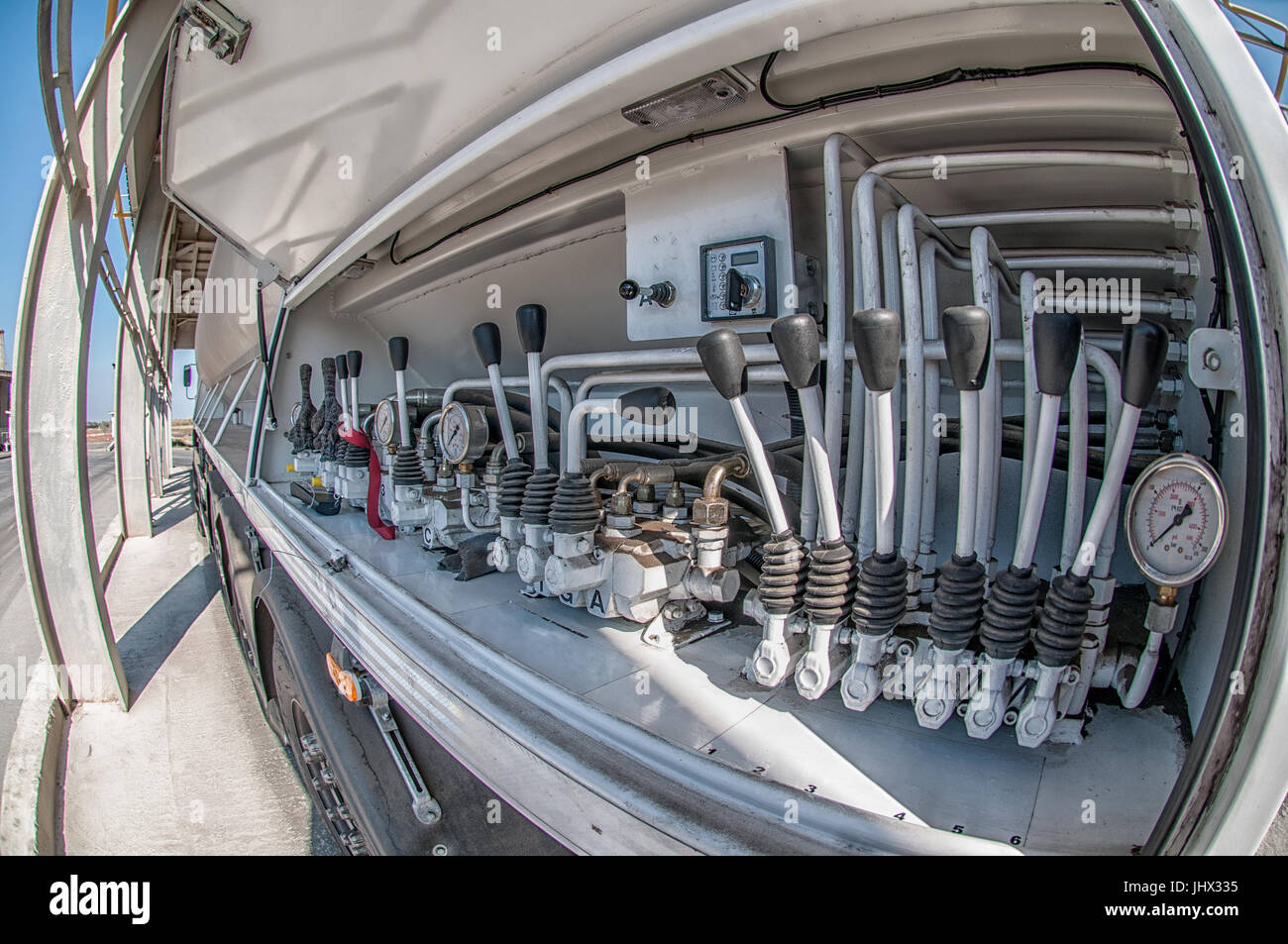Tank car and filling up to truck Stock Photo - Alamy