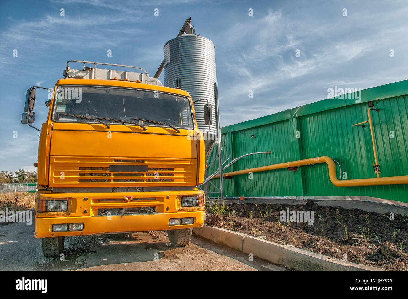 Tank car and filling up to truck Stock Photo - Alamy