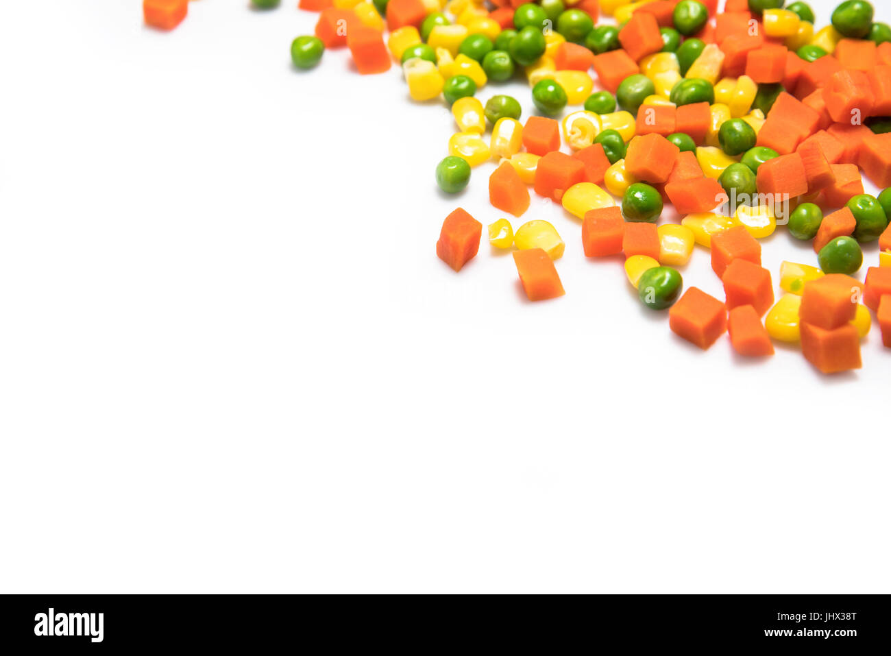 Mix of vegetable containing carrots, peas, and corn on white background ...