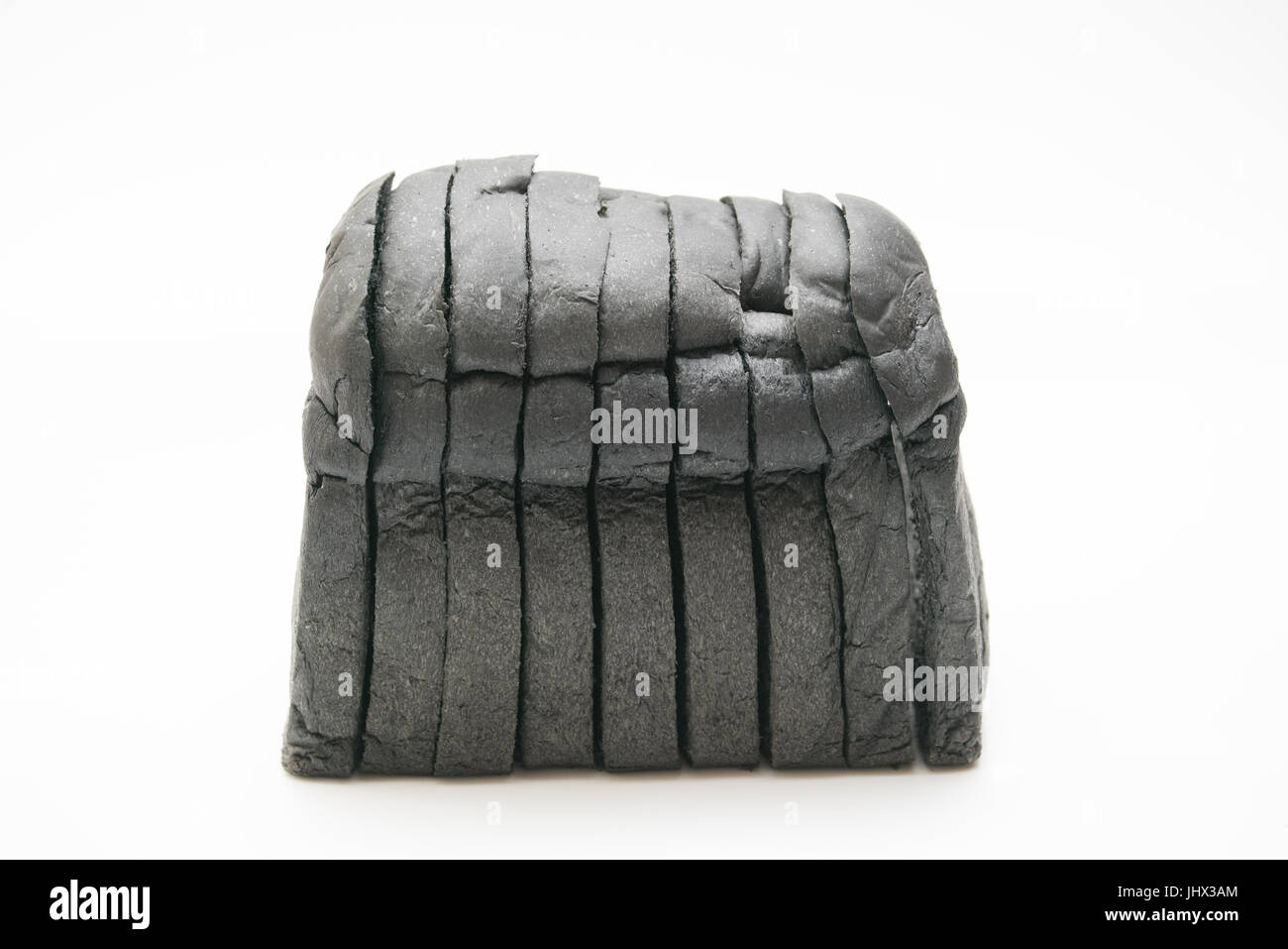 loaf slide of charcoal bread black bread isolated on white background ...