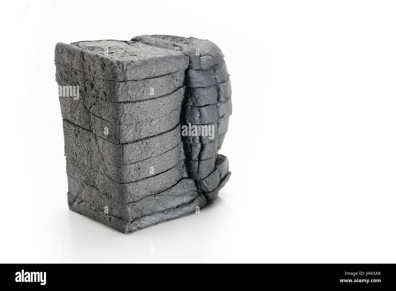 loaf slide of charcoal bread black bread isolated on white background ...