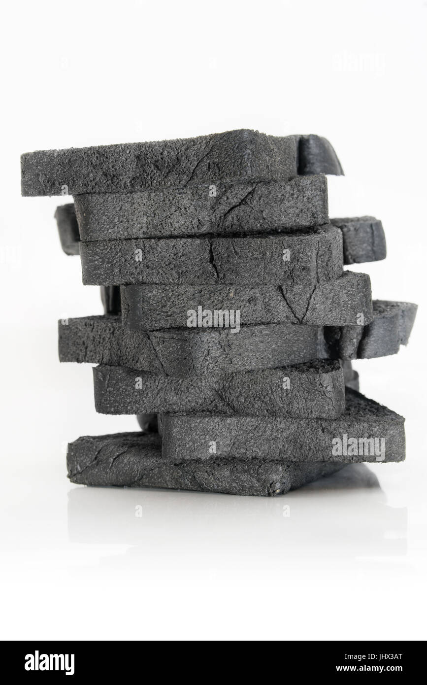 loaf slide of charcoal bread black bread isolated on white background ...
