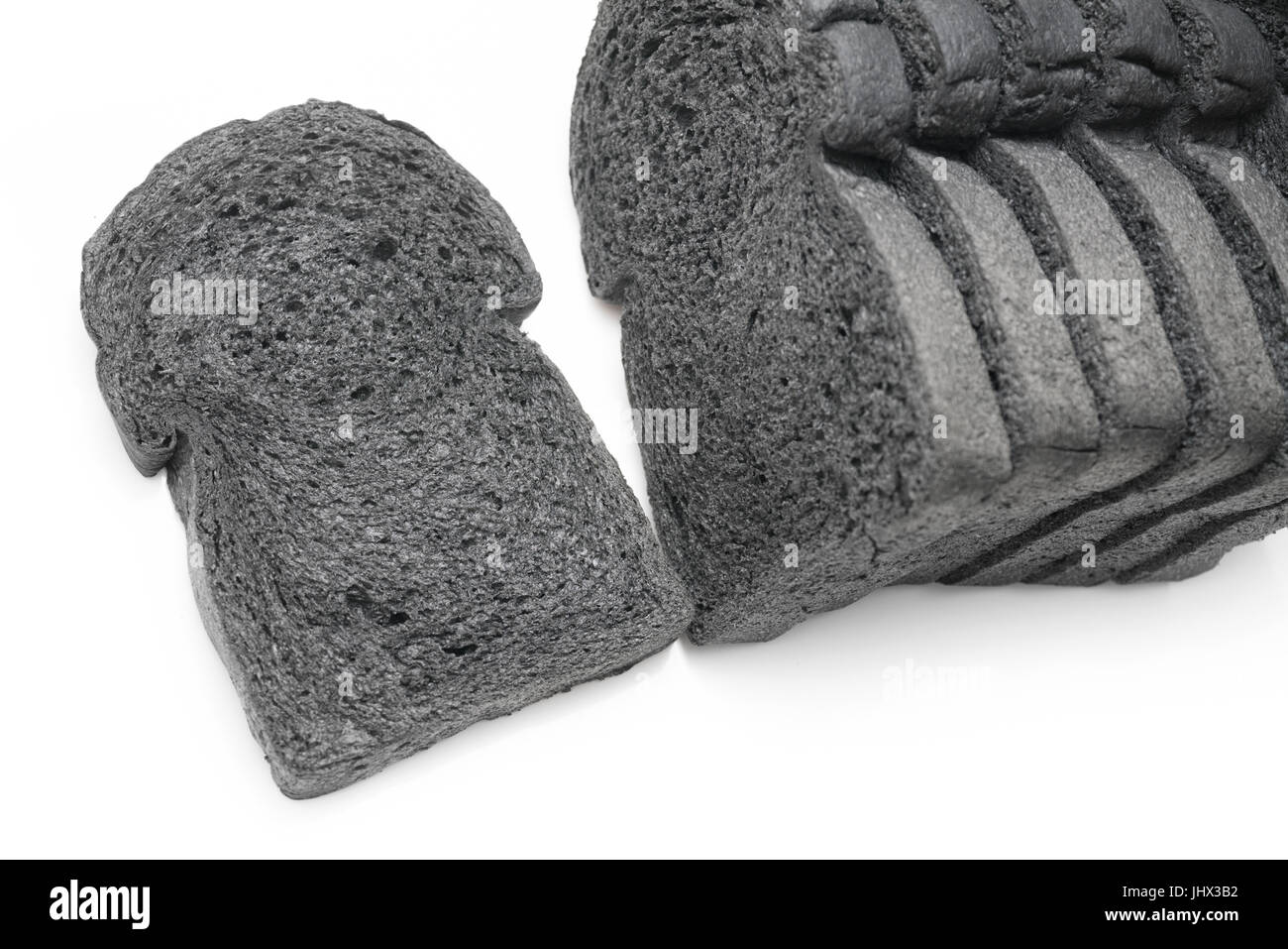 loaf slide of charcoal bread black bread isolated on white background ...