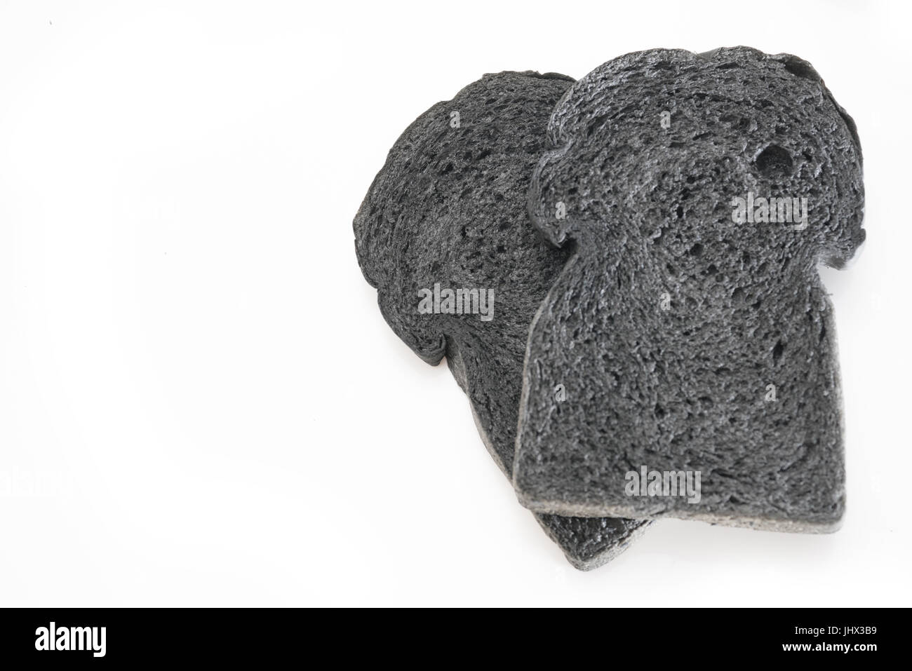 loaf slide of charcoal bread black bread isolated on white background ...