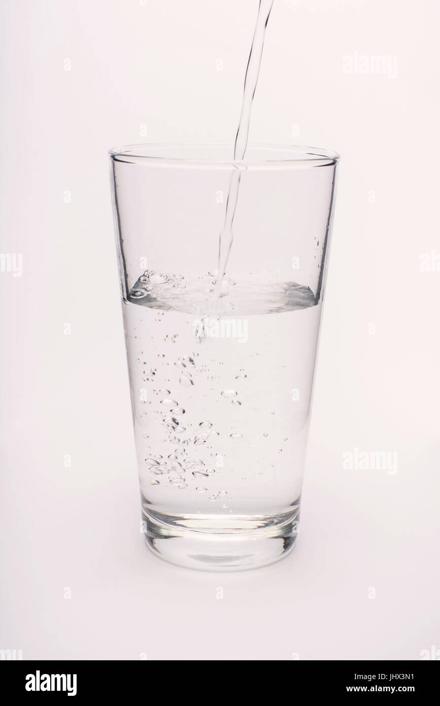 Water falling into a cup Stock Photo - Alamy