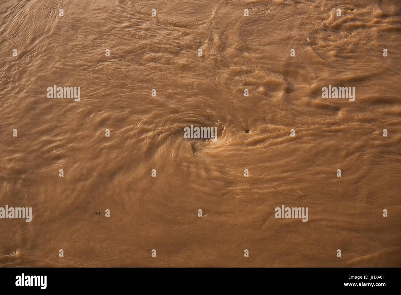 Muddy water flowing in the river after a rain storm Stock Photo - Alamy