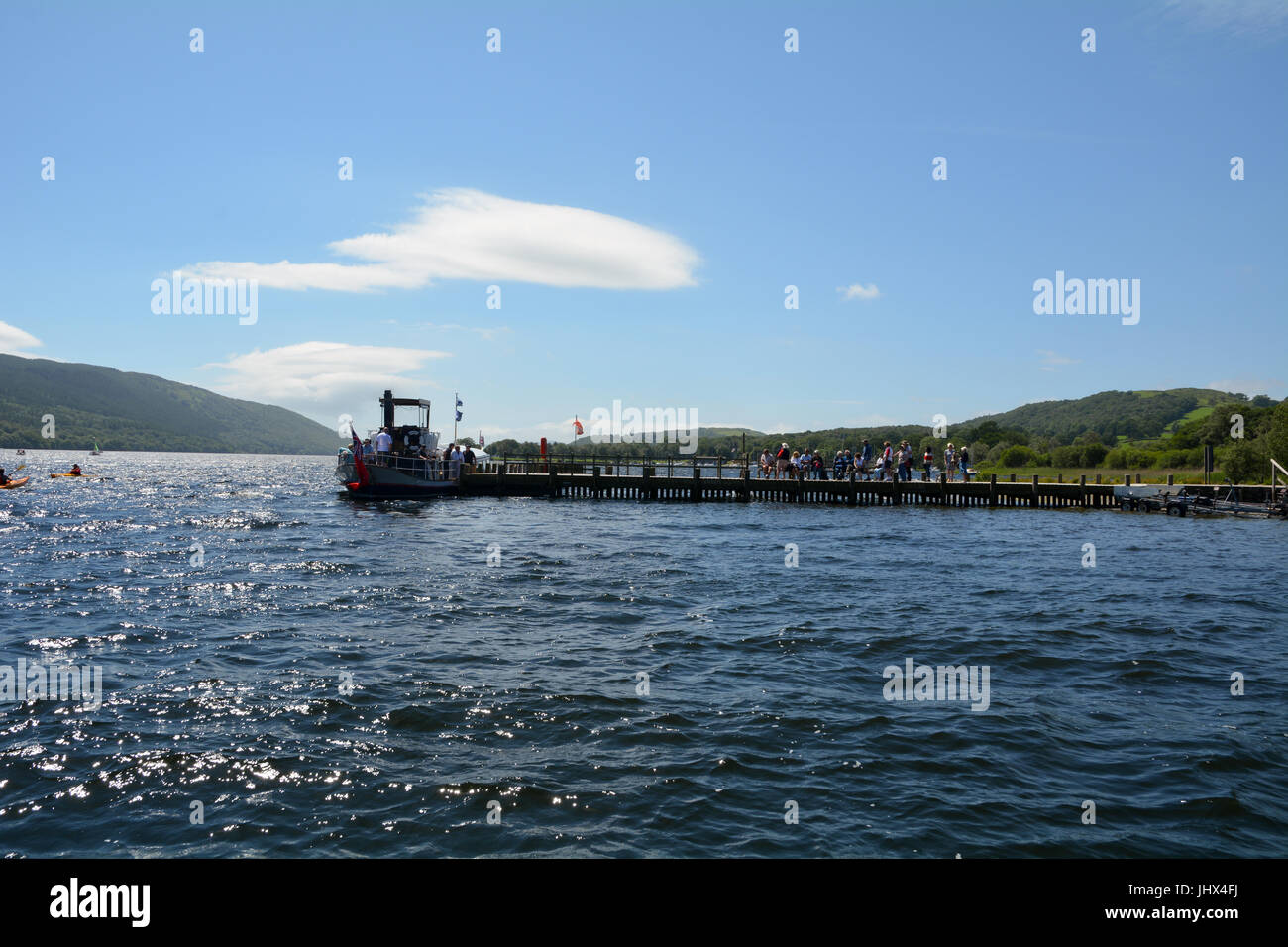 Tourists boarding the Steam Yacht Gondola on Coniston Water in the Lake ...