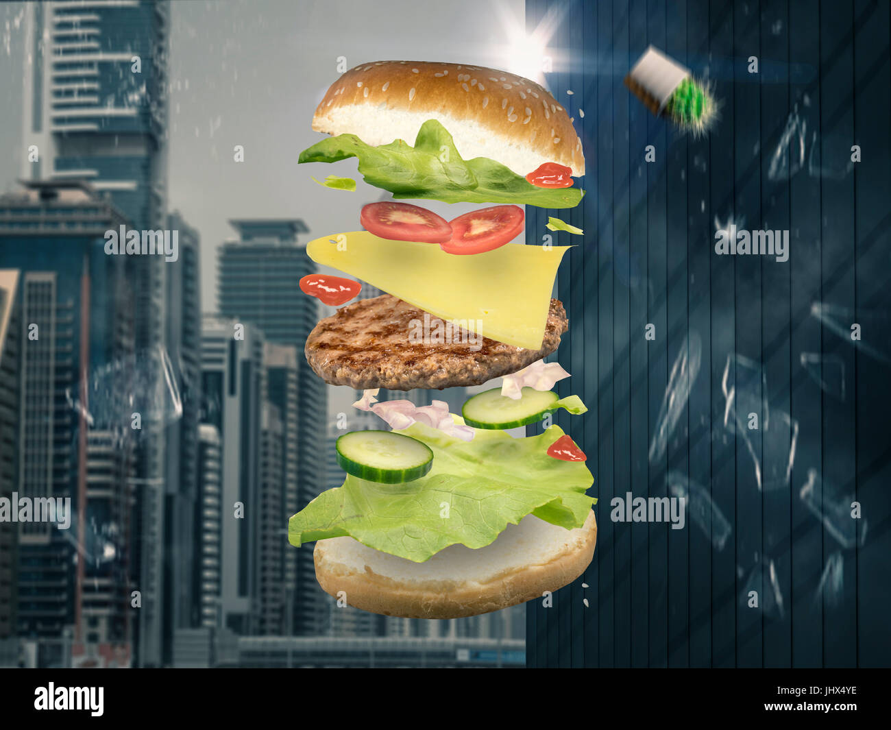 Fast food burger falls from a high rise Stock Photo - Alamy