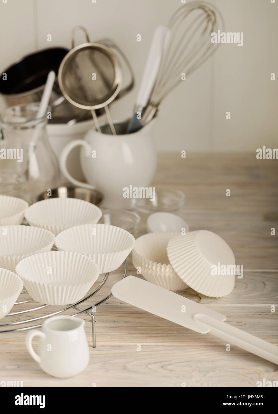 Kitchen tools of white and steel color (accessories) for baking on a ...