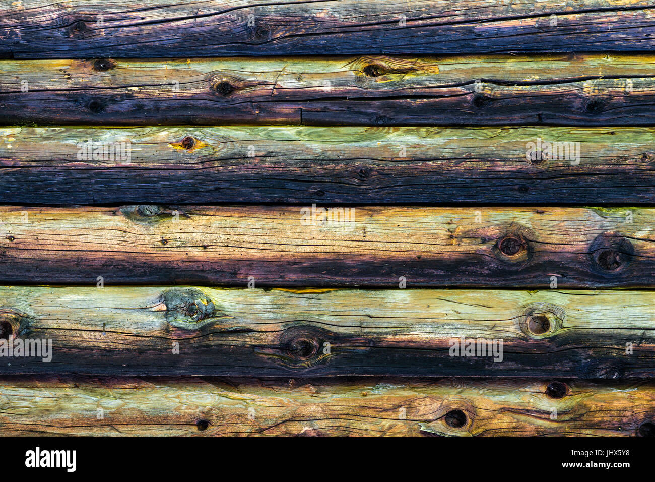 Natural colorful weathered log cabin wood wall. Wooden background ...
