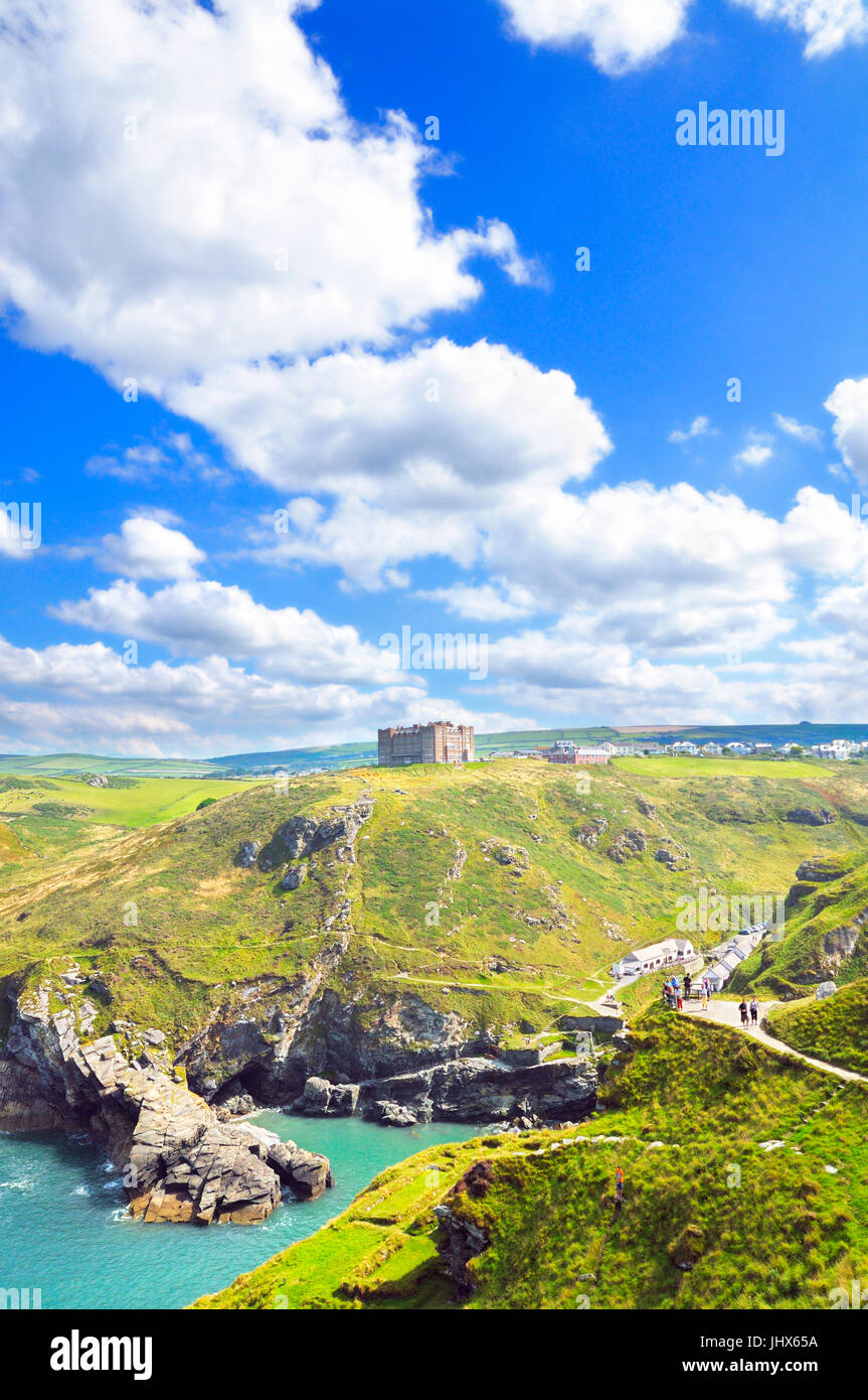 Tourists at the historic site of Tintagel Castle with Camelot Castle ...