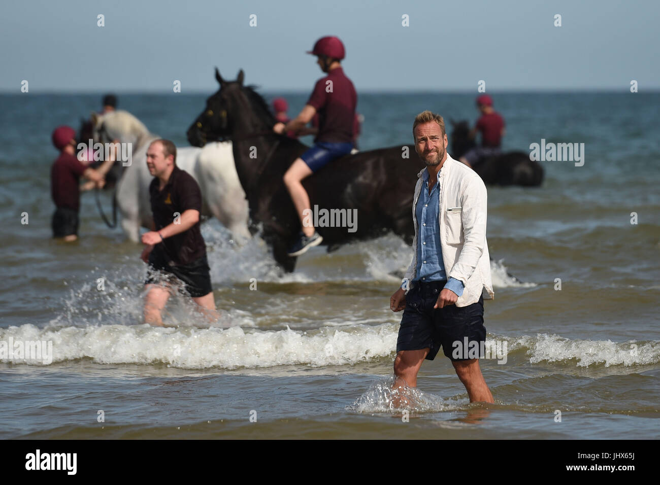TV presenter Ben Fogle watches troops from the Household Cavalry ...