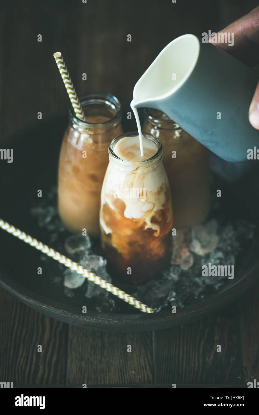 Cold Thai iced tea in bottles with milk Stock Photo - Alamy