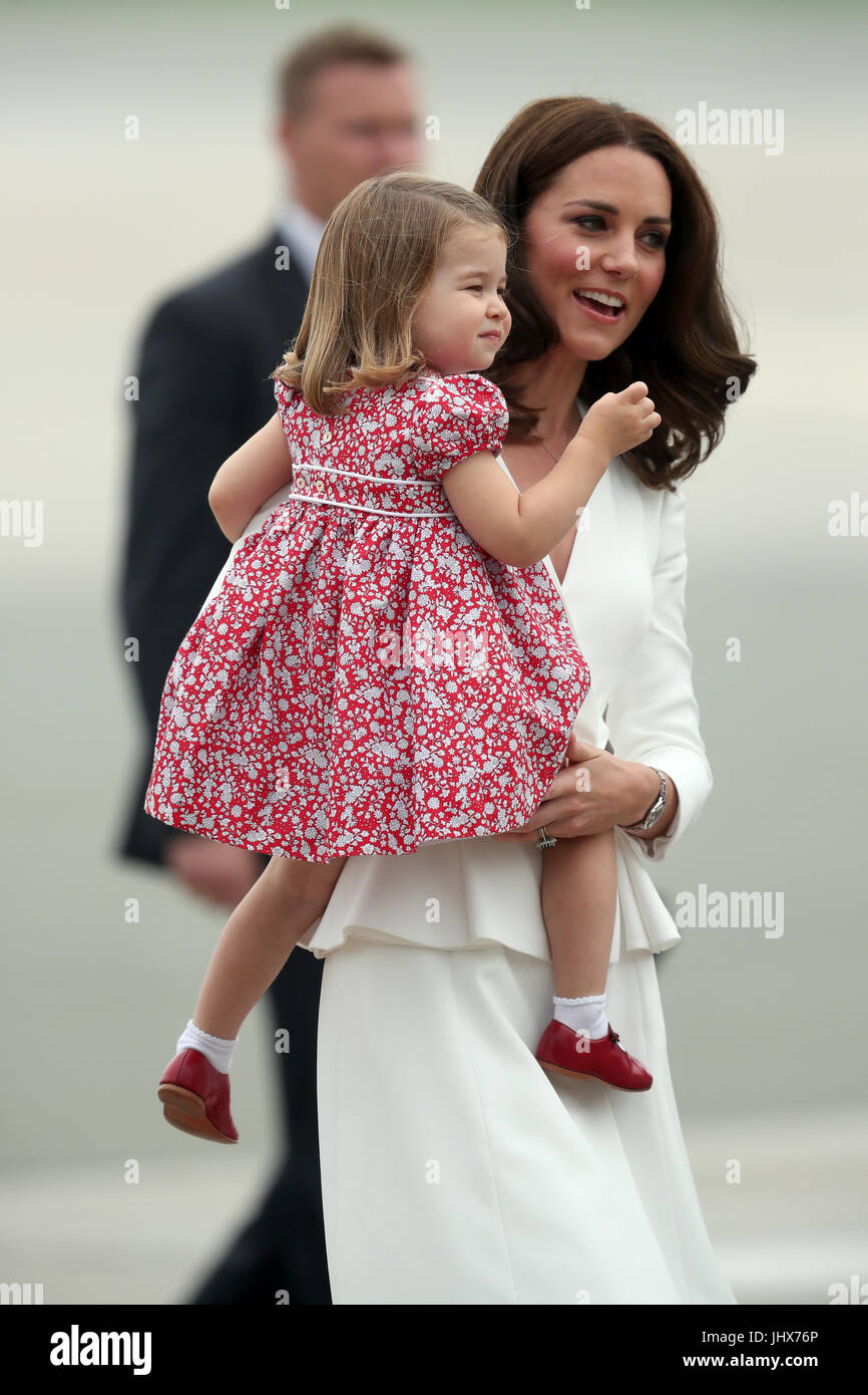 The Duchess of Cambridge, carrying Princess Charlotte, arrives with her ...