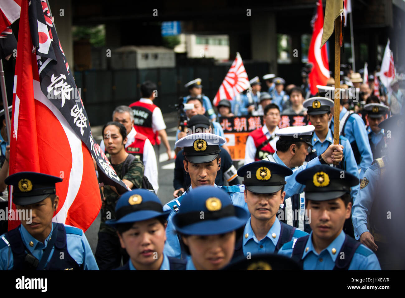 TOKYO, JAPAN - JULY 16: Japanese nationalists holding Japanese maritime ...