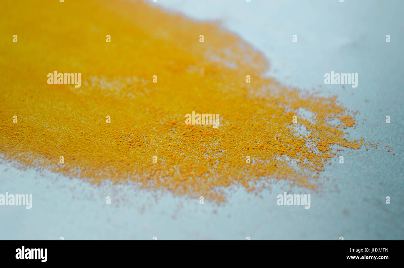 Abstract yellow powder background Stock Photo - Alamy