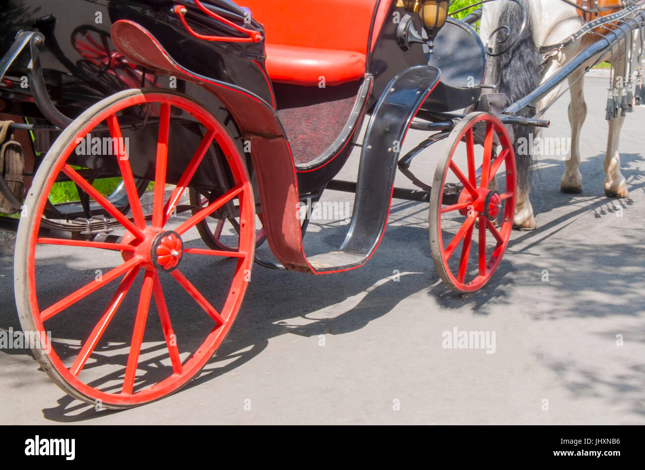 Red horse drawn carriage for walks in the park Stock Photo - Alamy