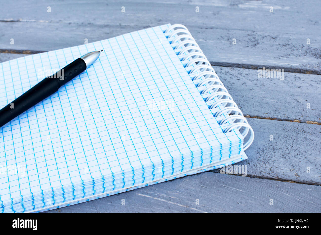A notepad in a box for entries on a wooden table Stock Photo - Alamy